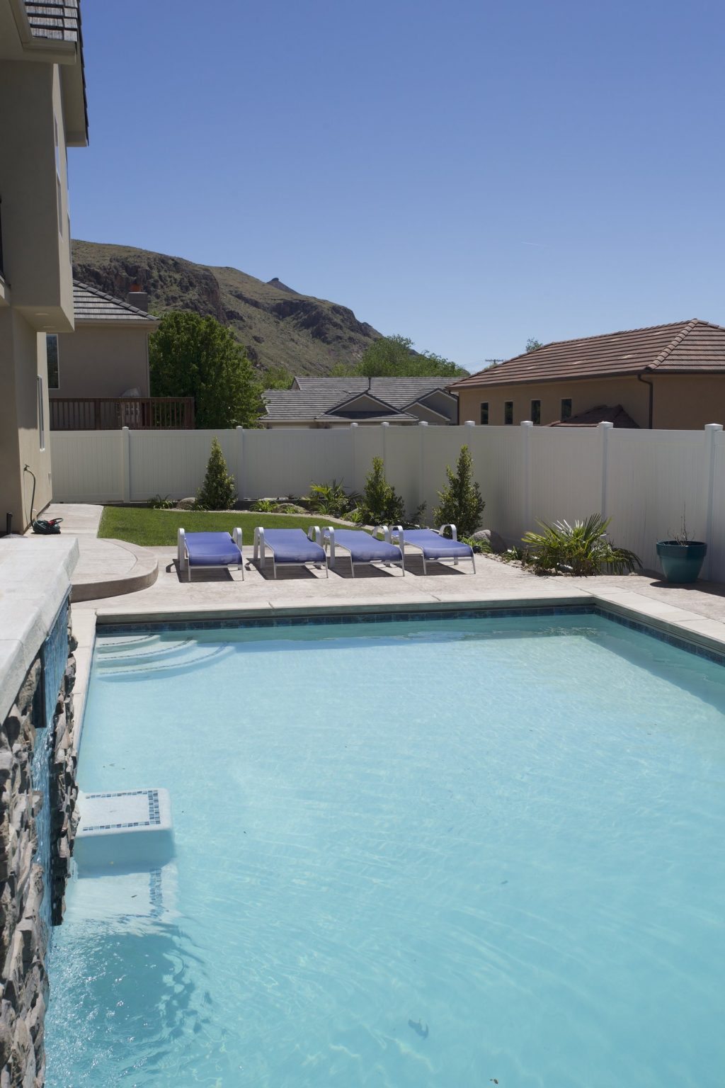 In-ground Swimming Pool With Waterfall Feature and Spa In Hurricane, Ut