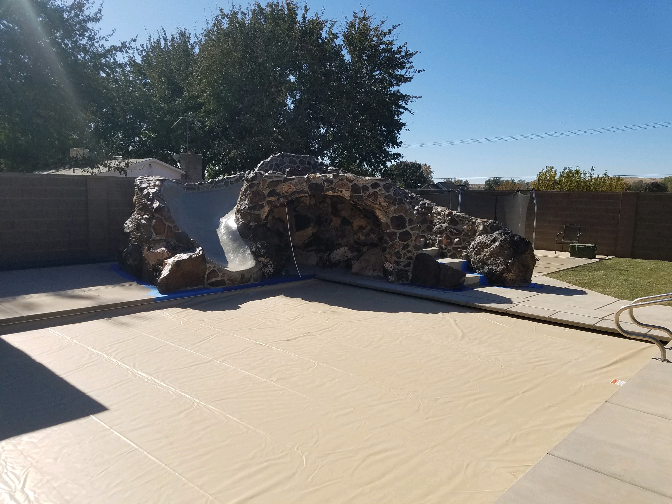 Create A Beautiful Natural Stone Water Feature For Your Swimming Pool