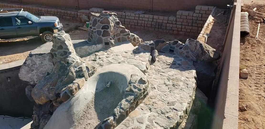 Create A Beautiful Natural Stone Water Feature For Your Swimming Pool