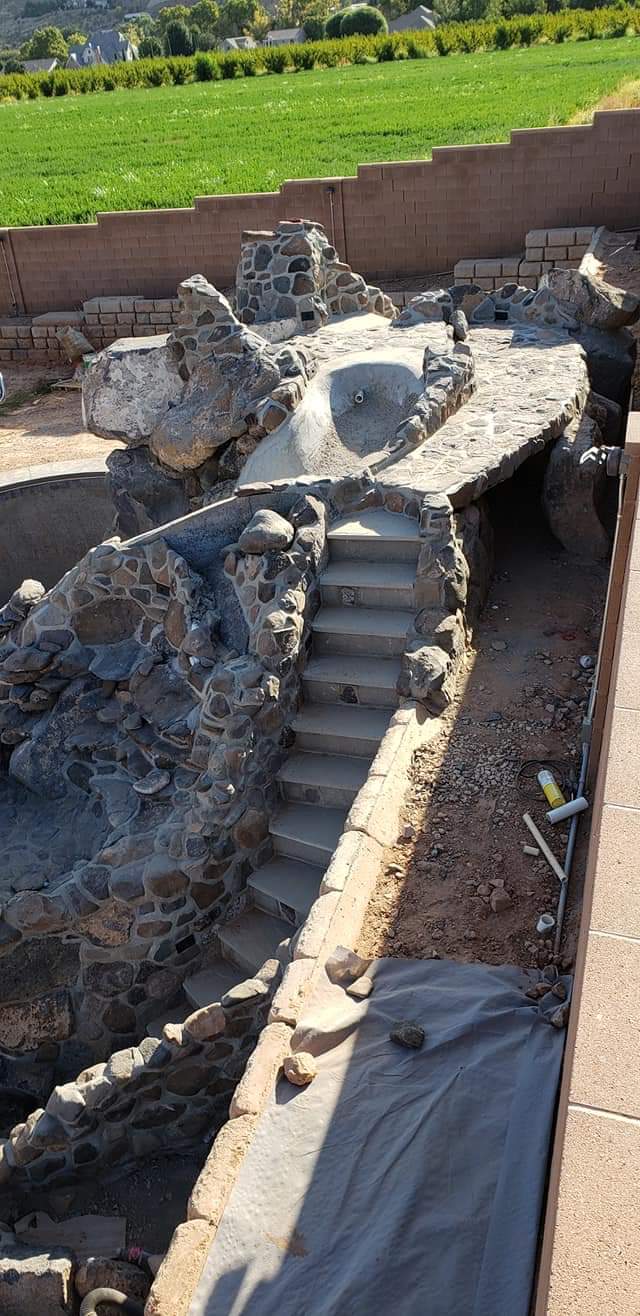 Create A Beautiful Natural Stone Water Feature For Your Swimming Pool