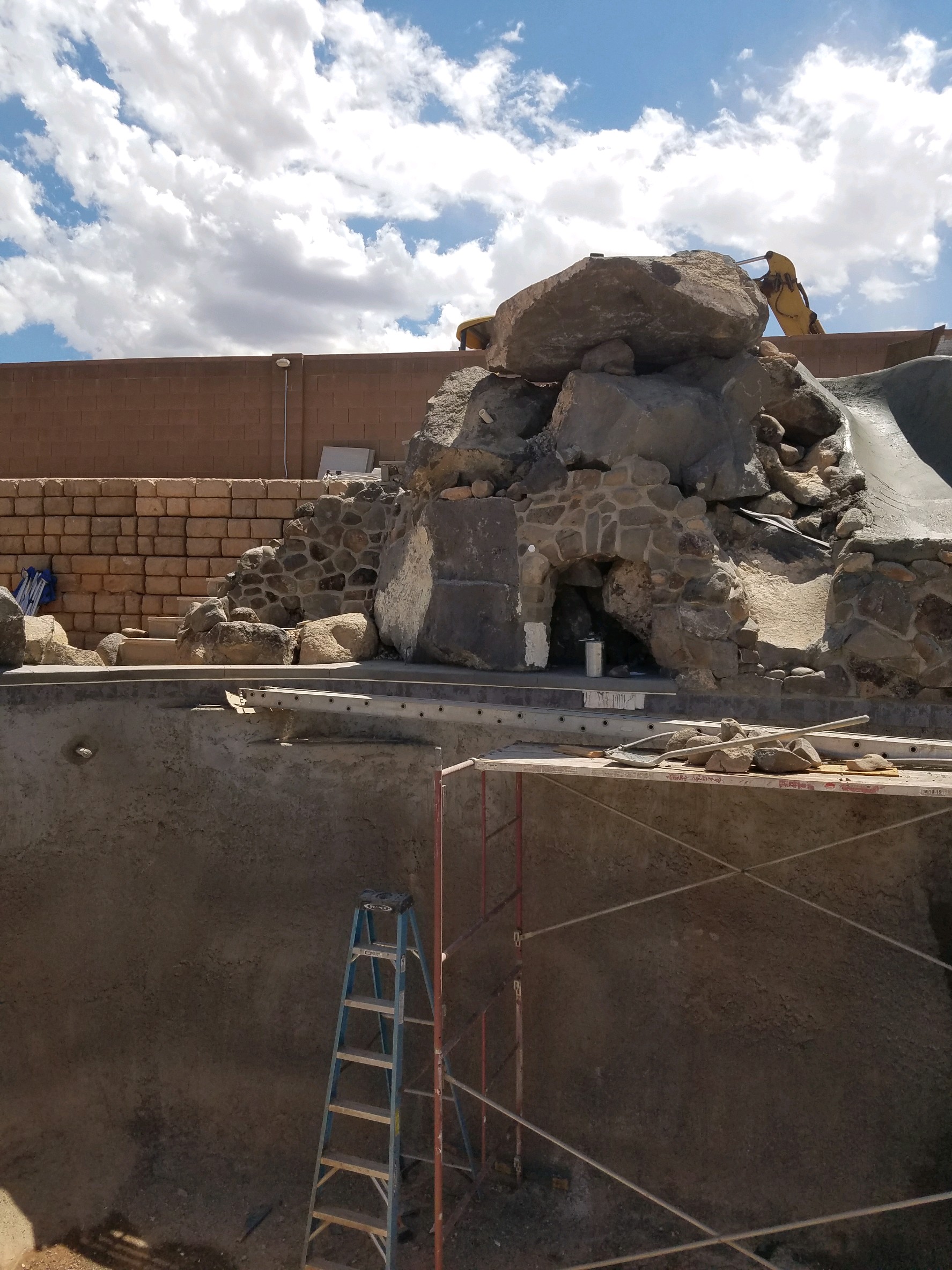 Create A Beautiful Natural Stone Water Feature For Your Swimming Pool